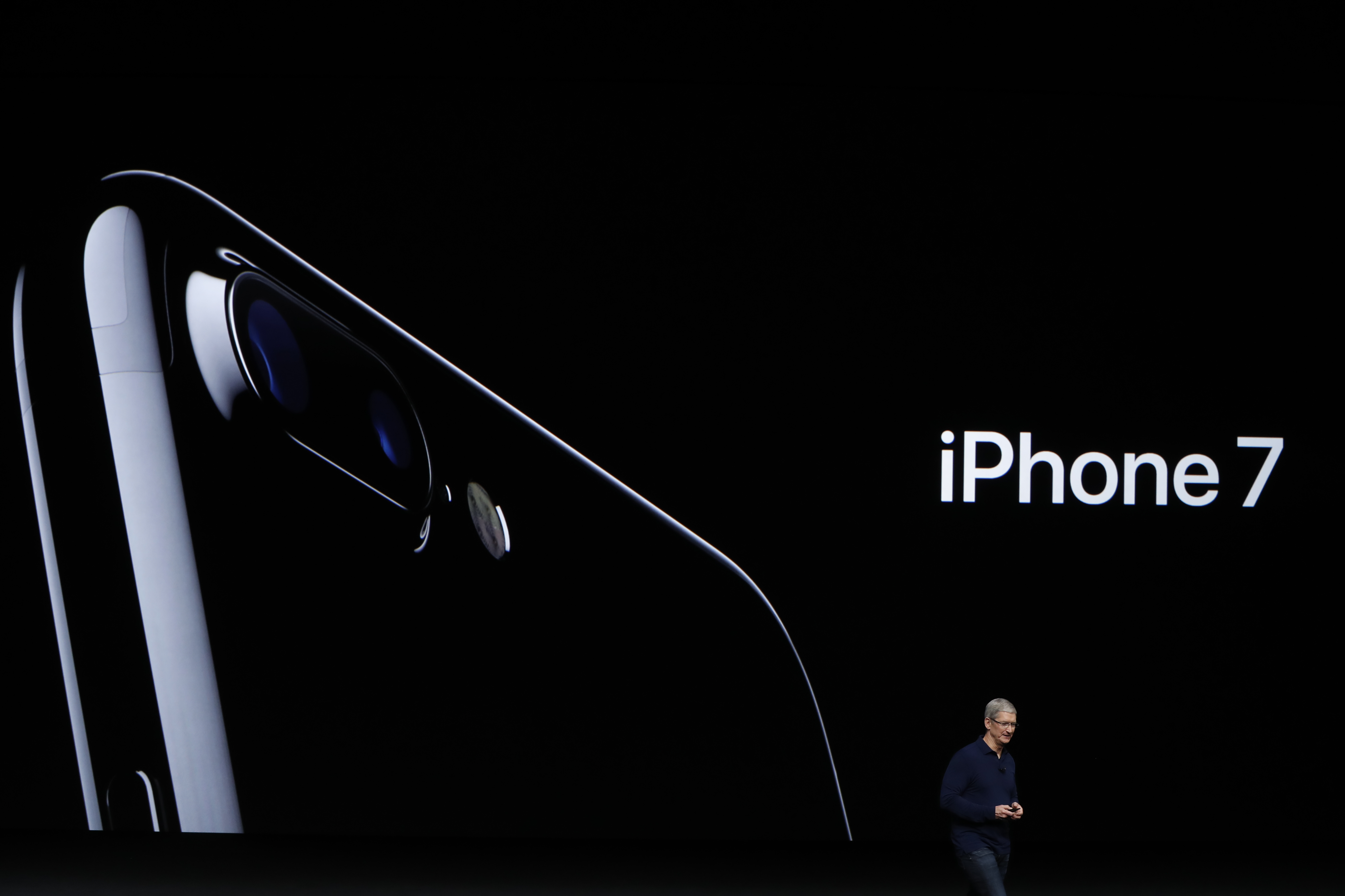 Apple CEO Tim Cook announces the new Apple iPhone 7 during a launch ...